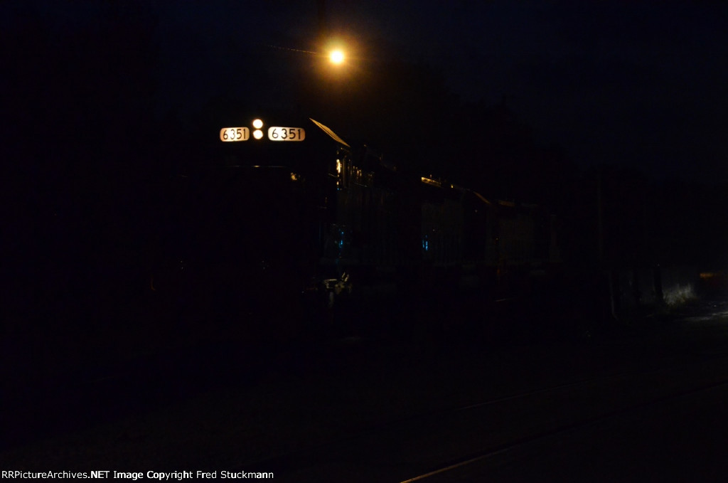 WE 6351 reflects on the events of the night under the lone yard light.